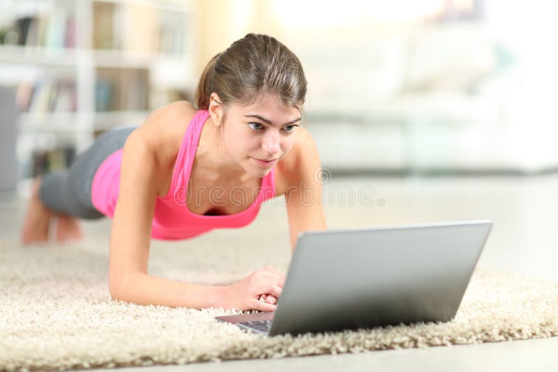 Doing Exercise Watching Online Tutorial Stock Image - Image of abdomen ... Doing Exercise Watching Online Tutorial Stock Image - Image of abdomen ...