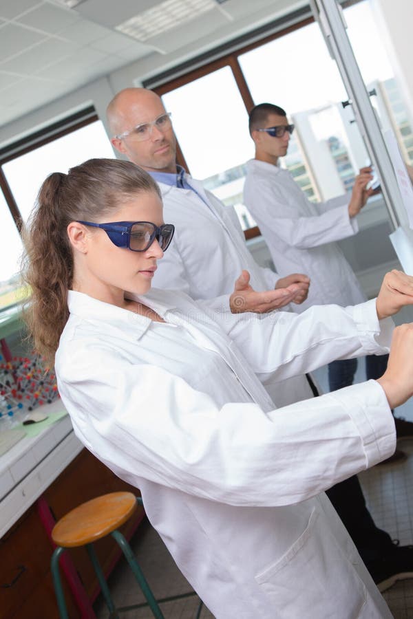 Doing experiment in lab stock photo. Image of professor - 93833406