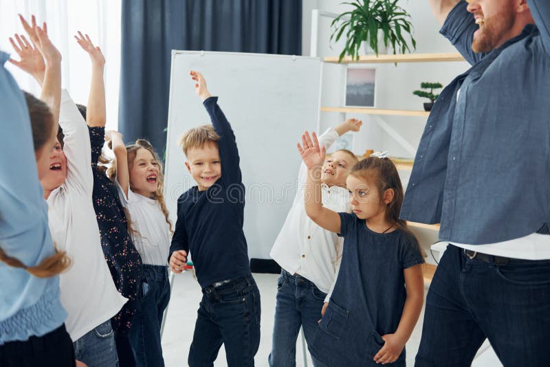 Doing Hands Gestures for Future Success. Group of Children Students in ...