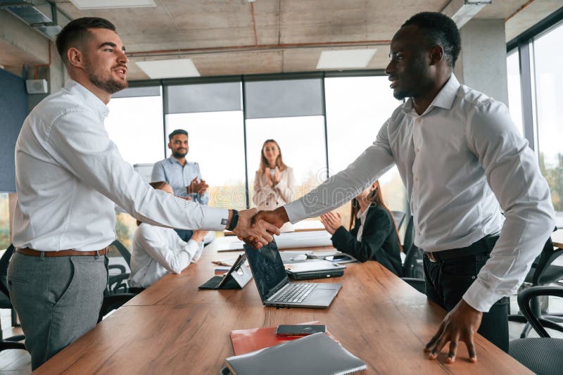 Doing Handshake. Group of Office Workers are Together Indoors Stock ...