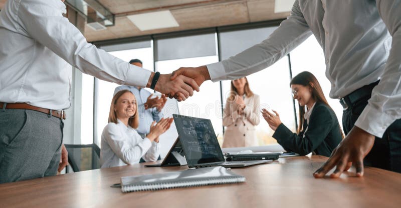 Doing Handshake. Group of Office Workers are Together Indoors Stock ...