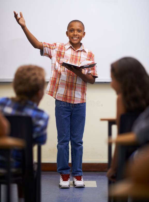 Doing His Prepared Reading. a Young Boy Doing Prepared Reading at the ...