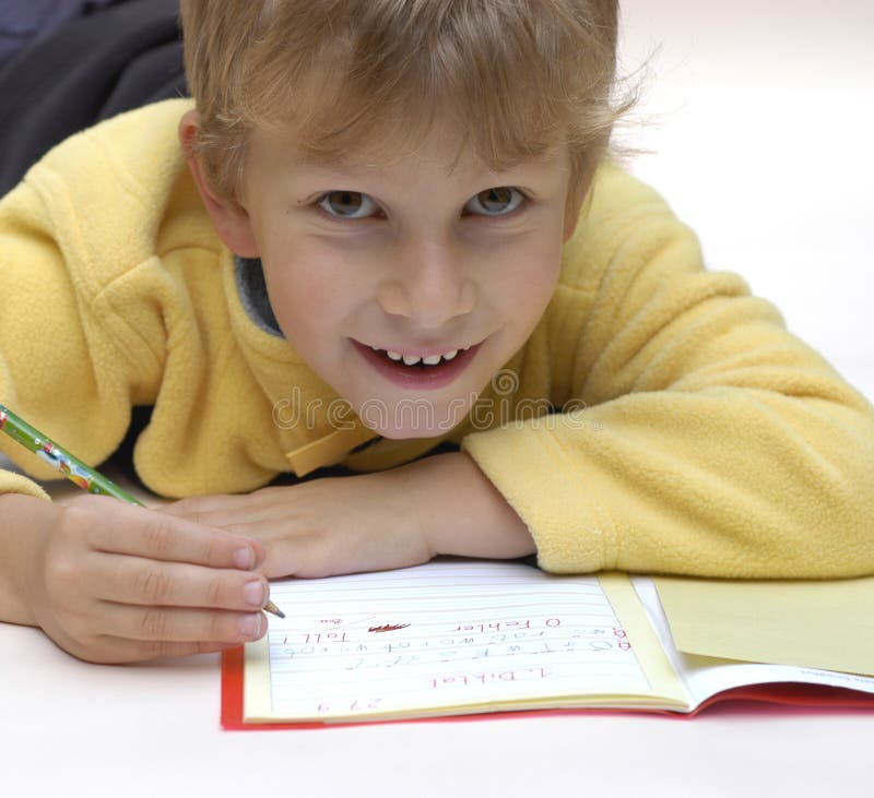 Doing homework stock image. Image of blond, smiles, writing - 269449
