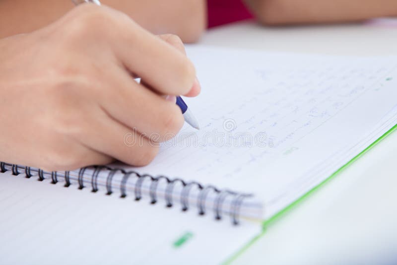 College or University Student Doing School Homework at Home. Working ...