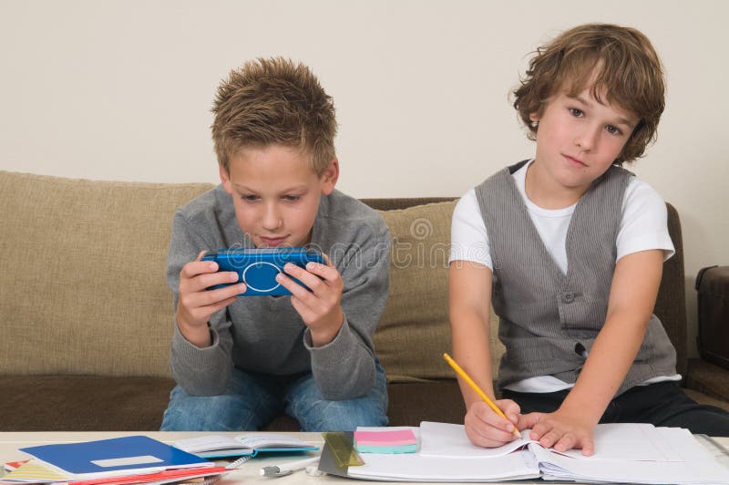 Doing Homework while Gaming Stock Photo - Image of learning, school ...