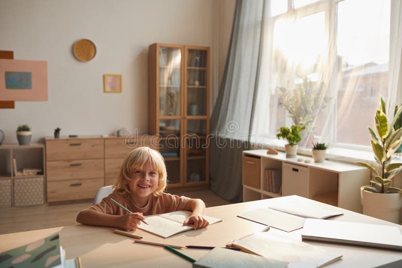 Doing homework at home stock image. Image of paperwork - 198967041