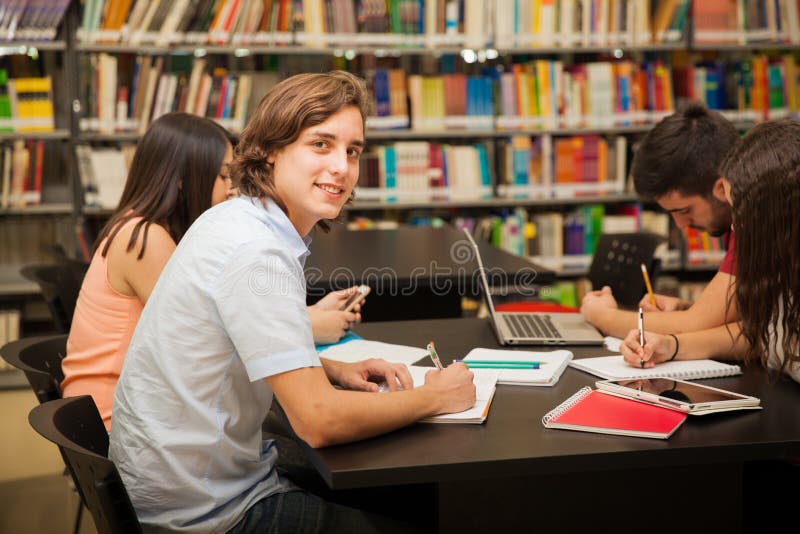 Doing Homework in the Library Stock Image - Image of group, book: 53809131
