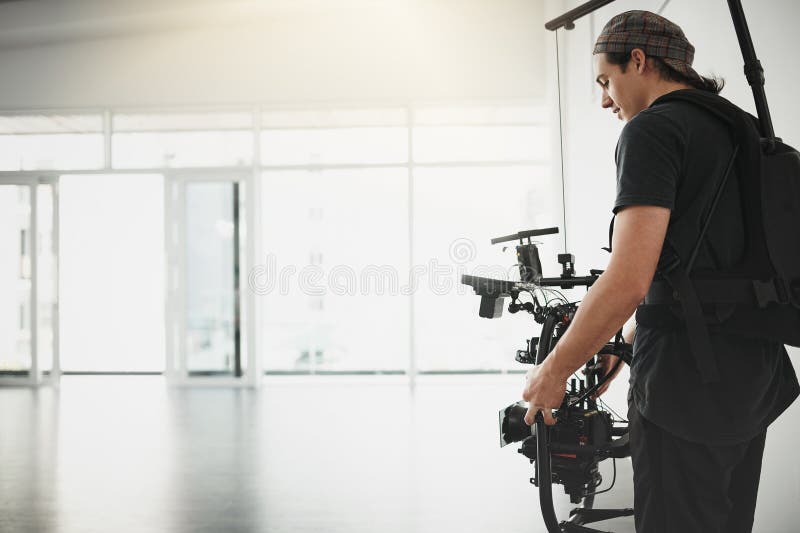 Doing it Like a Pro. Behind the Scenes Shot of a Camera Operator ...