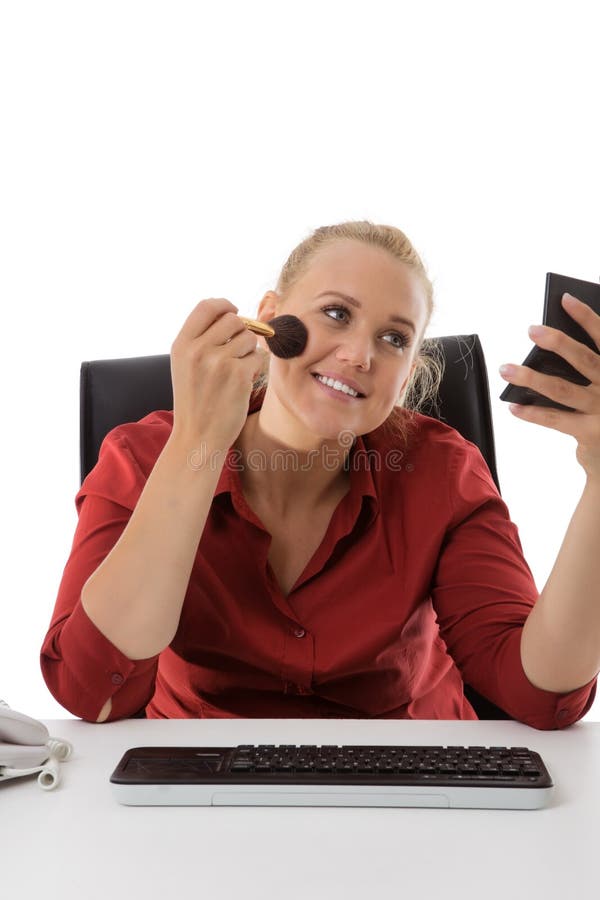 Doing make up at work stock photo. Image of attractive - 42178354