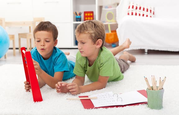 Doing Math Exercises at Home Stock Photo - Image of math, laying: 21483890