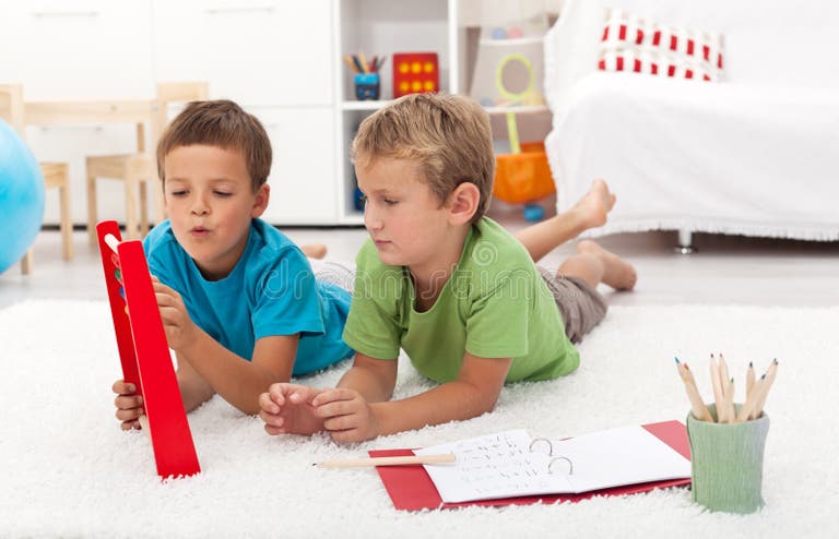 Doing Math Exercises at Home Stock Photo - Image of math, laying: 21483890