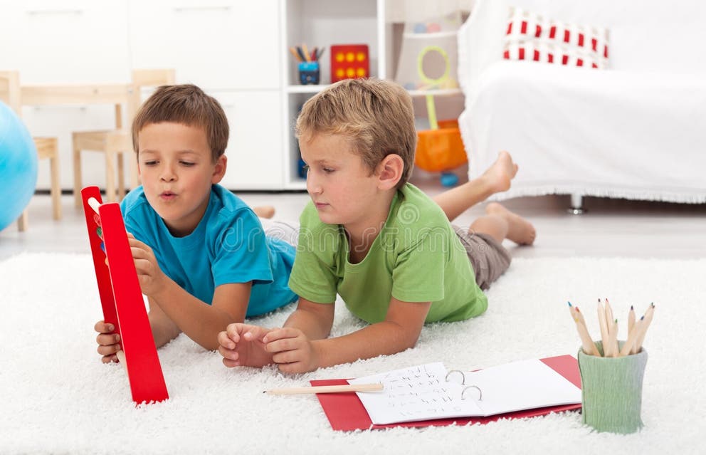 Doing Math Exercises at Home Stock Photo - Image of math, laying: 21483890