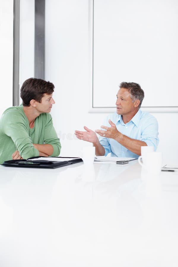 Doing Some Creative Thinking. a Young Office Worker Discussing Ideas ...