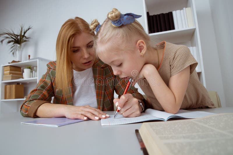 Doing Tasks and Studying Concept. Sitter with Girl Writing Homework ...
