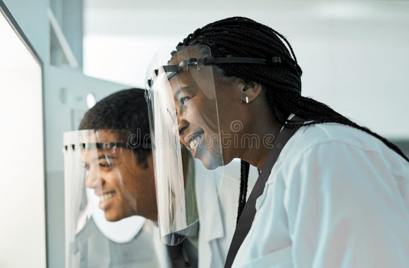 Doing Their Best To Make a Breakthrough. Two Scientists Wearing Face ...