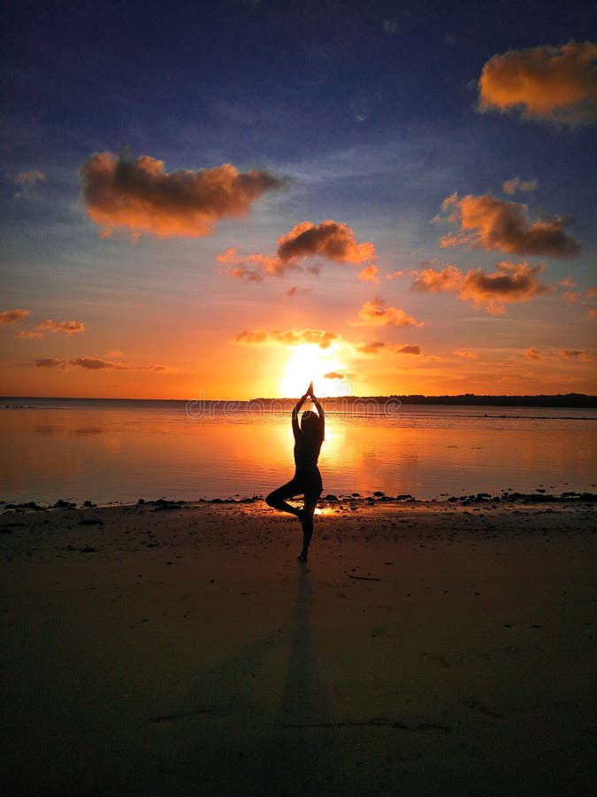Doing Yoga Activities at Sunset on the Beach Stock Image - Image of ...