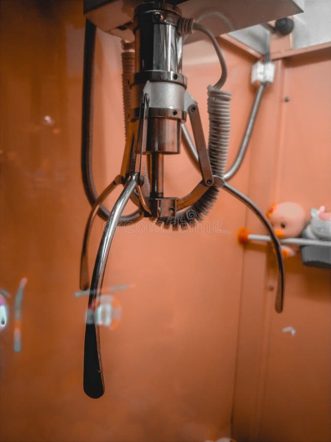 DOLL ClAW MACHINE stock image. Image of claw, iron, room - 223293897