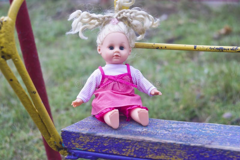 Doll on swing stock image. Image of swing, hair, childhood - 66004889