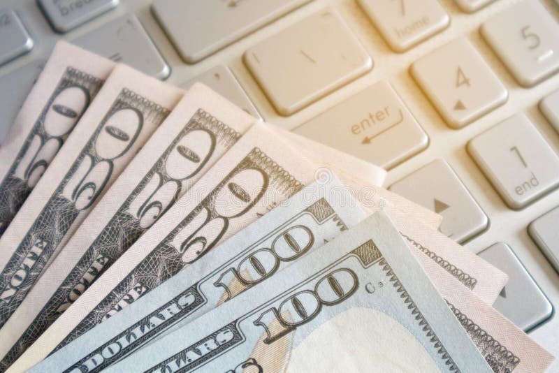 Dollar Banknote on a Laptop. Earned Money by Working from Laptop at ...