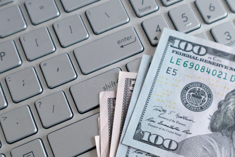Dollar Banknote on a Laptop. Earned Money by Working from Laptop at ...