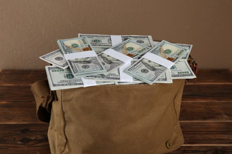 Dollar Banknotes in Bag on Wooden Table Stock Photo - Image of ...