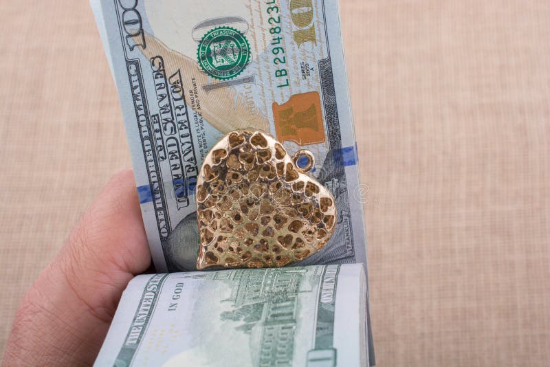 Dollar Banknotes with a Heart Clip on a String Stock Photo - Image of ...