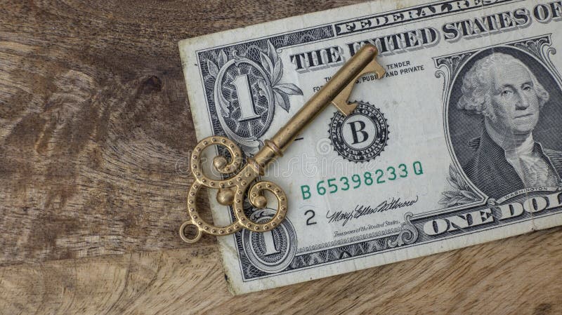 Dollar Bill with Old Vintage Key. Money Opens Many Doors Stock Image ...