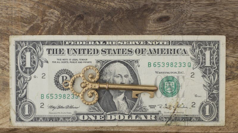 Dollar Bill with Old Vintage Key. Money Opens Many Doors Stock Photo ...