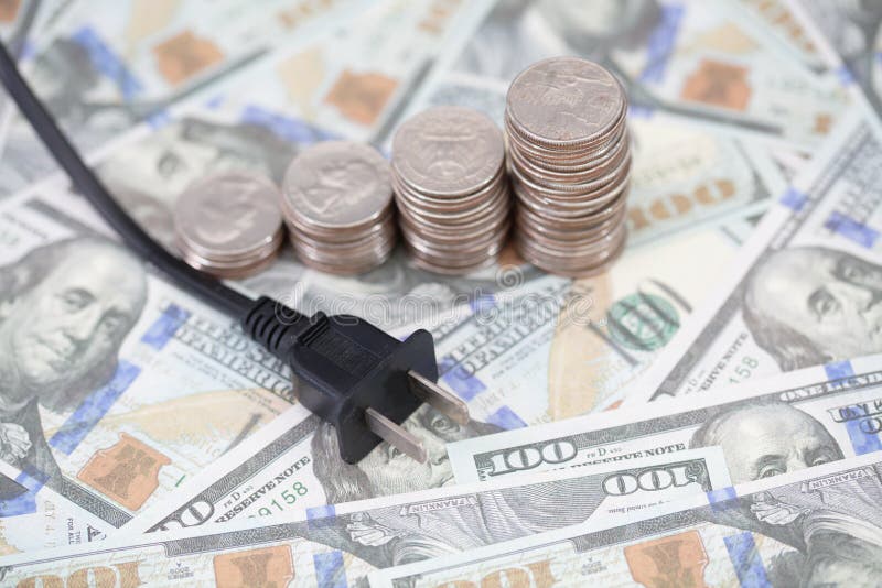 Dollar Bills and Coins and an Electric Plug Stock Image - Image of ...