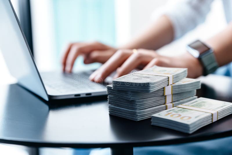 Dollar on Table with Businesswoman Doing Work in Office Stock Photo ...