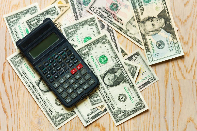 Dollars and calculator stock image. Image of calculator - 39780163