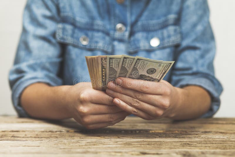 Dollars in Hand, Small Salary. Winning the Lottery Stock Photo - Image ...