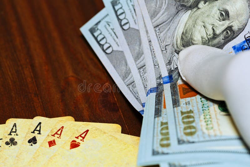 Dollars Holded in Hand Over the Poker Playing Cards Stock Image - Image ...