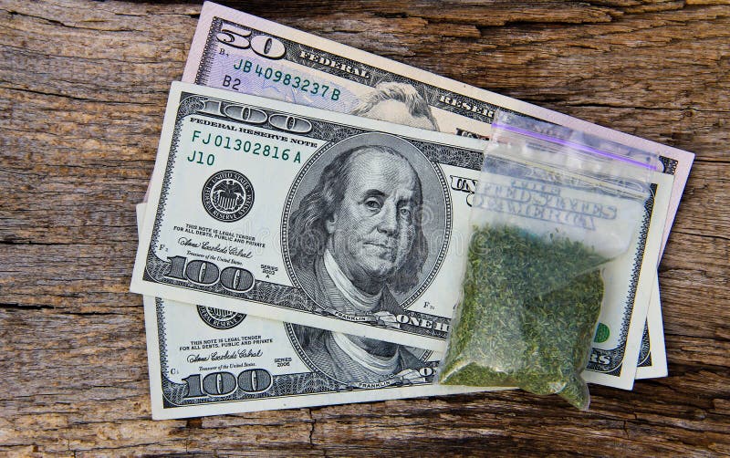 Dollars and Marijuana in Packet on Wooden Background Stock Photo ...