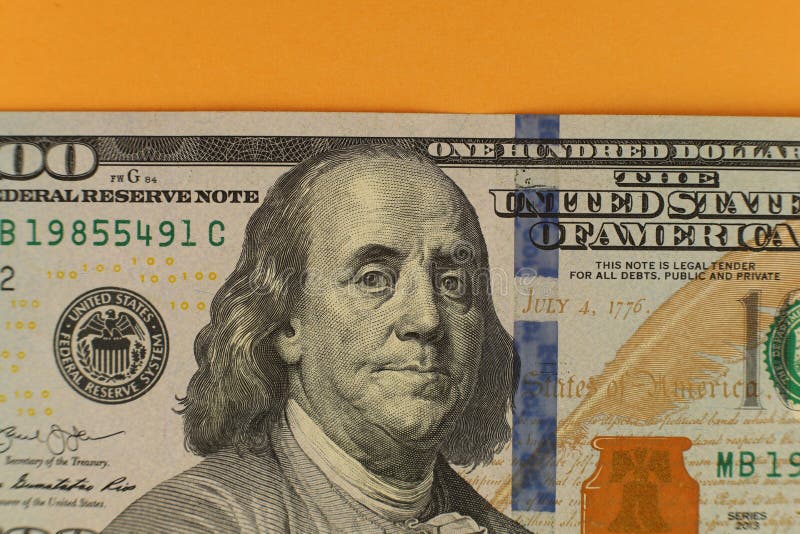 Dollars Money Hand through a Hole in an Orange Cardboard Stock Photo ...