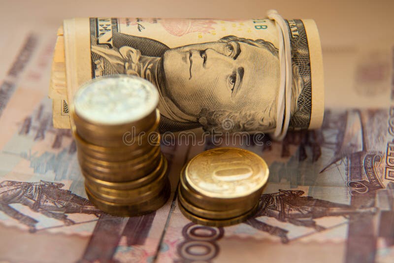 Dollars in a Tube and Ruble Bills of 500 and Coins of Rubles Stock ...