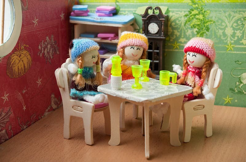 Dolls sit at the table stock image. Image of little, model - 65793373
