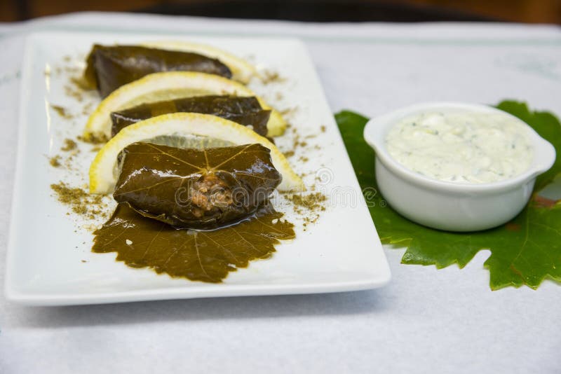 Dolma with lemon and sauce stock image. Image of mediterranean - 171422259