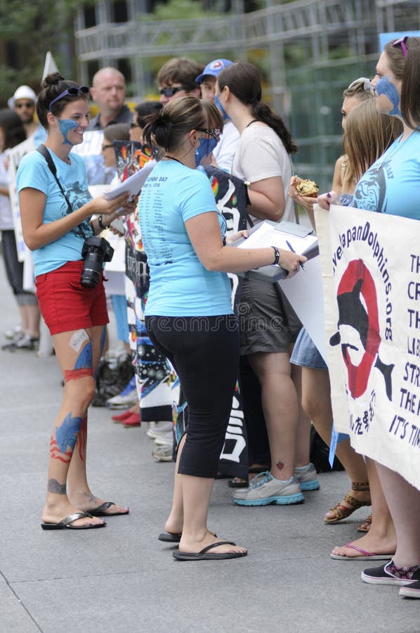 Dolphin hunting protest. editorial photography. Image of crowd - 26393117