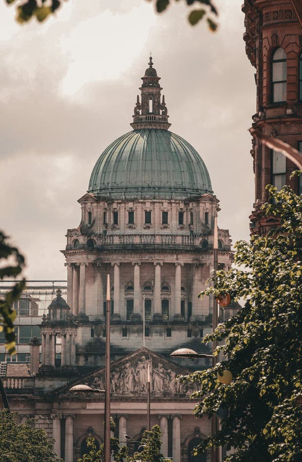 A Dome Building with a Clock in Front of it and People Standing Outside ...