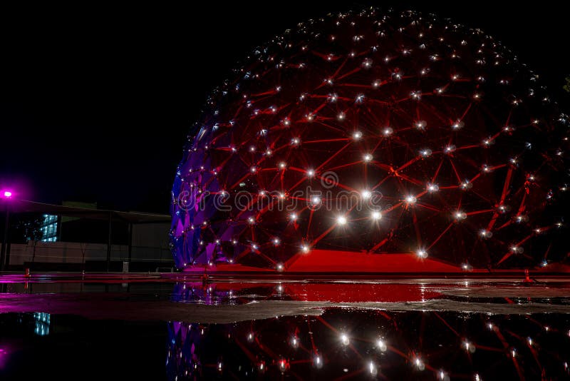 Dome Shaped Building, with Colored Lights, Reflection in Water ...