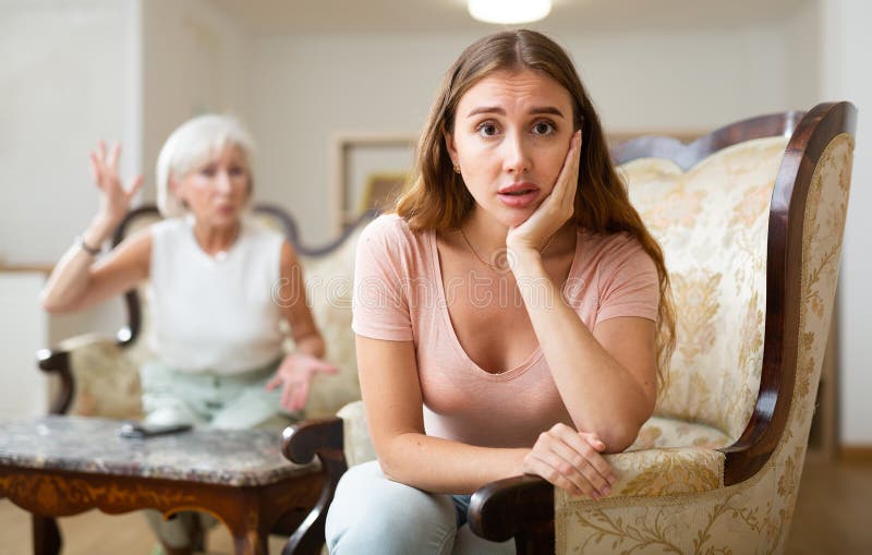 Domestic Quarrel Between Elderly Mother And Adult Daughter In Living
