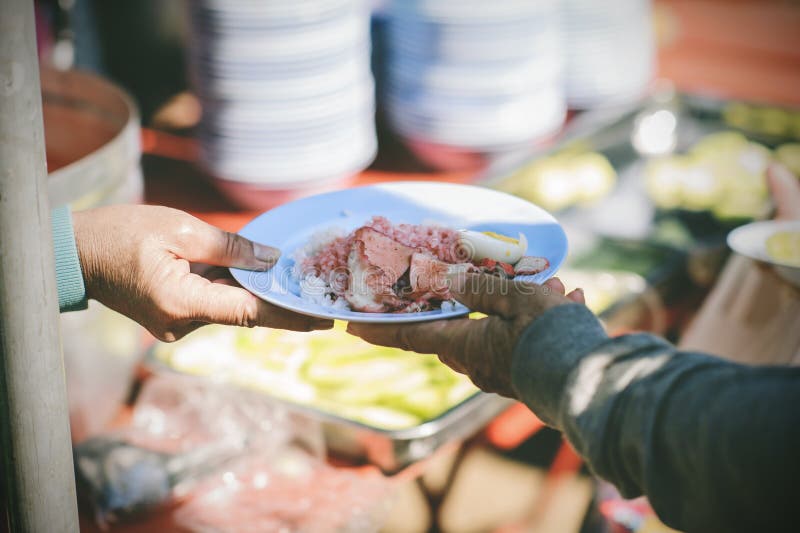 Donate Food To the Poor and Hungry: Concept of Feeding Stock Image ...
