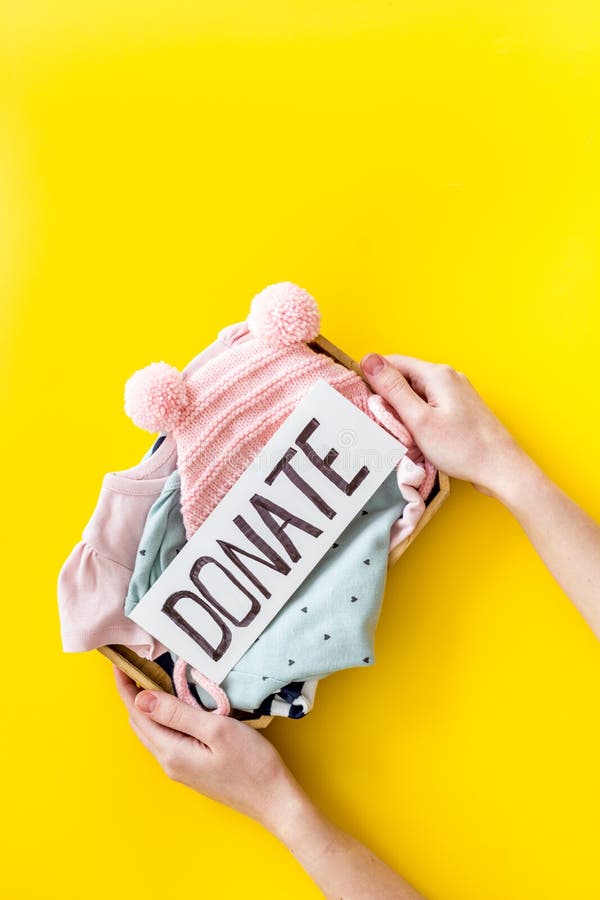 Donate Text Box Clothes Kids Yellow Background Top Down Stock Photos ...