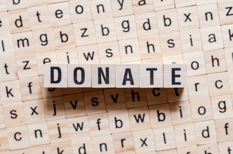 Word Donate Of Cut Letters On Blue Background. Donation Concept ...