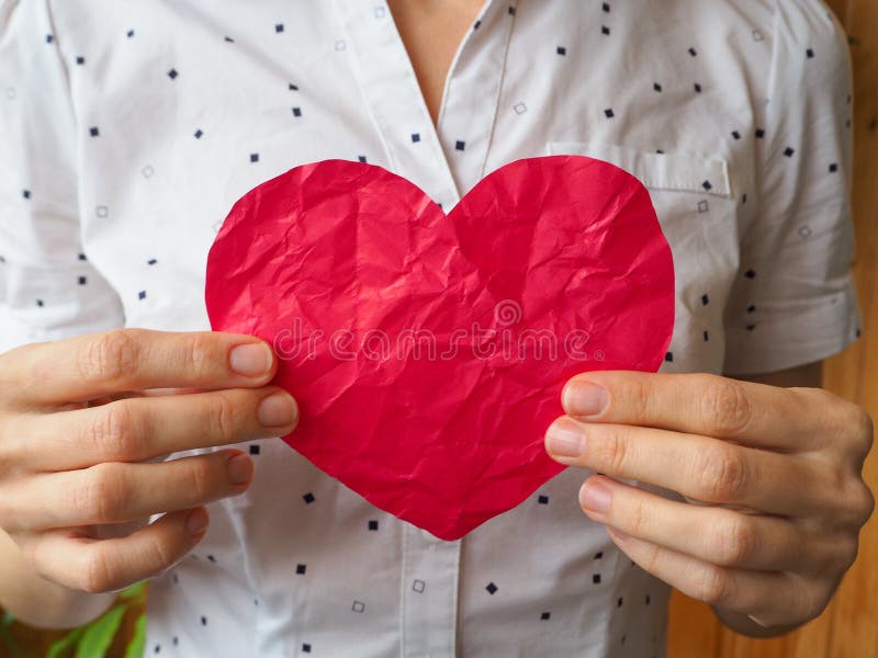 Donated Heart. Large and Small Red Heart in His Hand. Stock Image ...