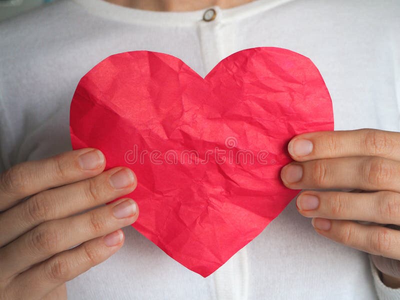 Donated Heart. Large and Small Red Heart in His Hand. Stock Image ...