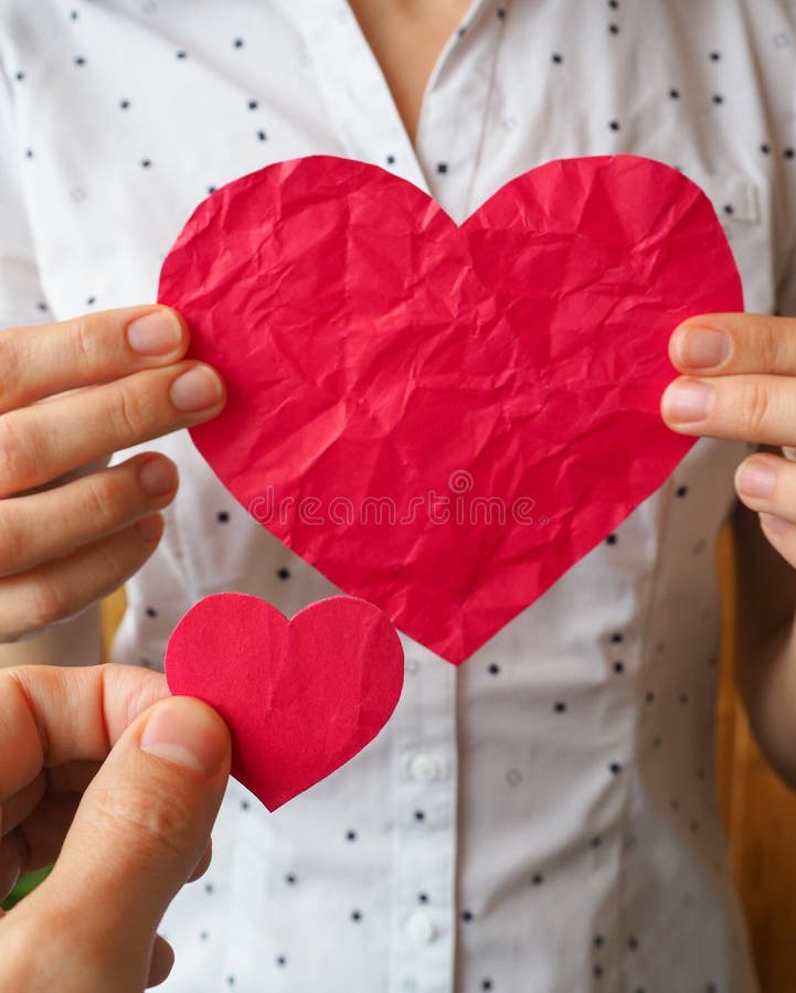 Donated Heart. Large and Small Red Heart in His Hand. Stock Photo ...