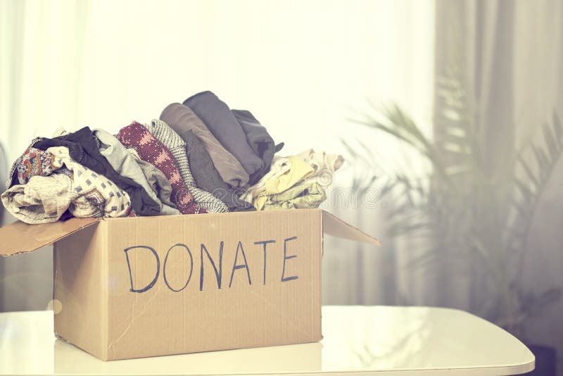 Donation Box with Clothing on the Table. Garage Sale, Second Hand Stock ...