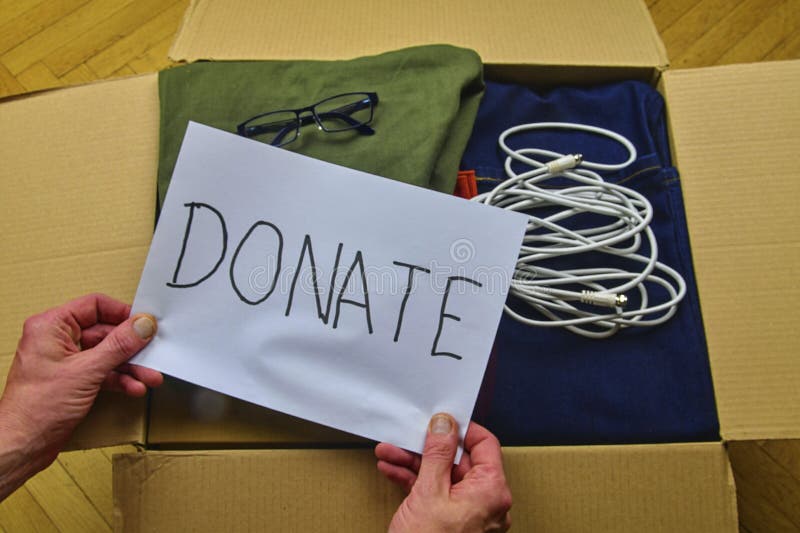 Donation Concepts with Hands of Man Holding Text Donate Giving and ...